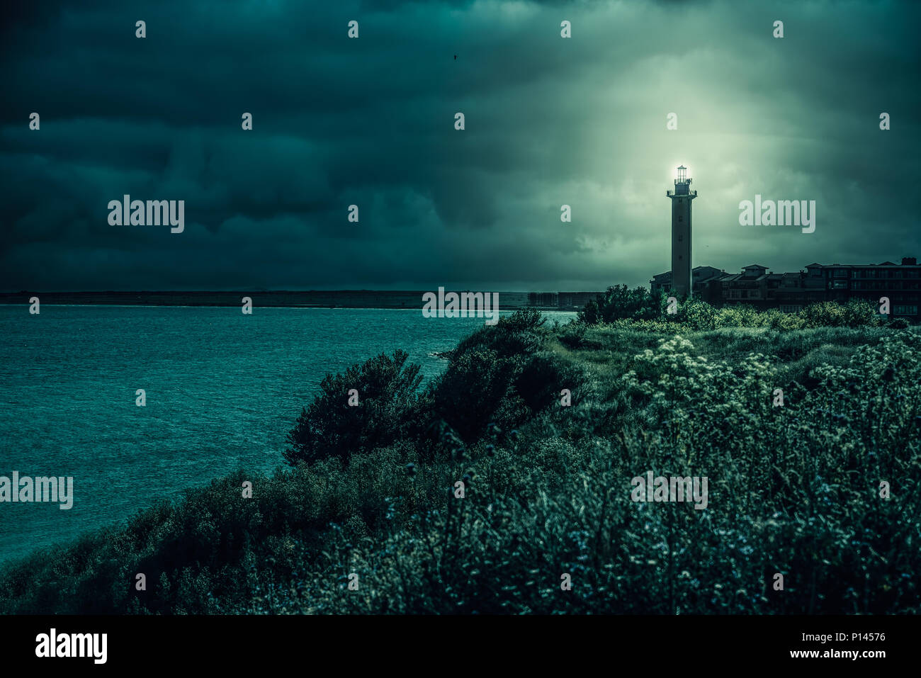 Lighthouse and bad weather in background Stock Photo - Alamy