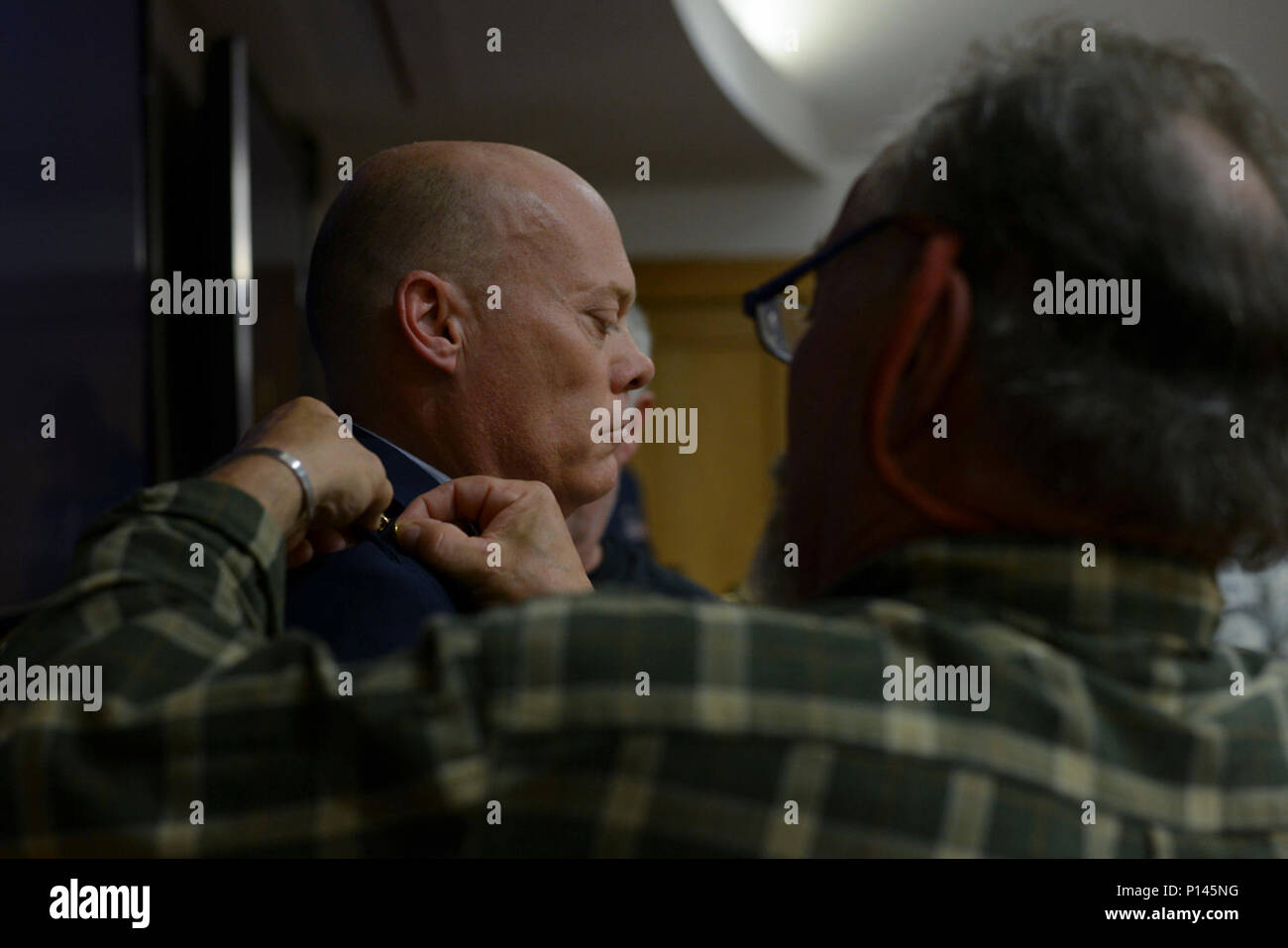 U.S. Air Force Maj. Richard Daigle has his rank pinned by family ...