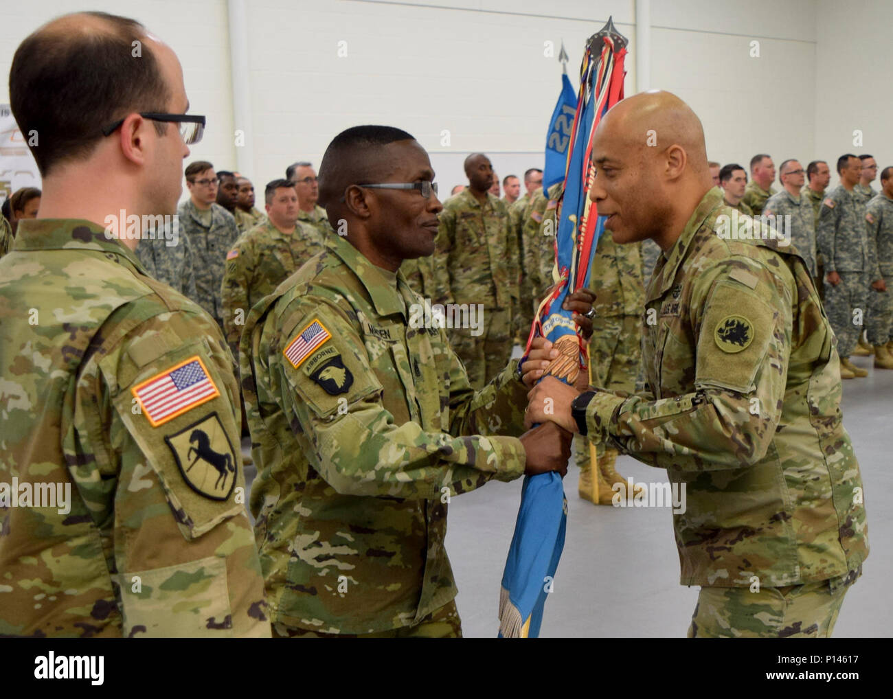 Command Sgt. Major Donald Madden hands the colors of the Georgia Army ...