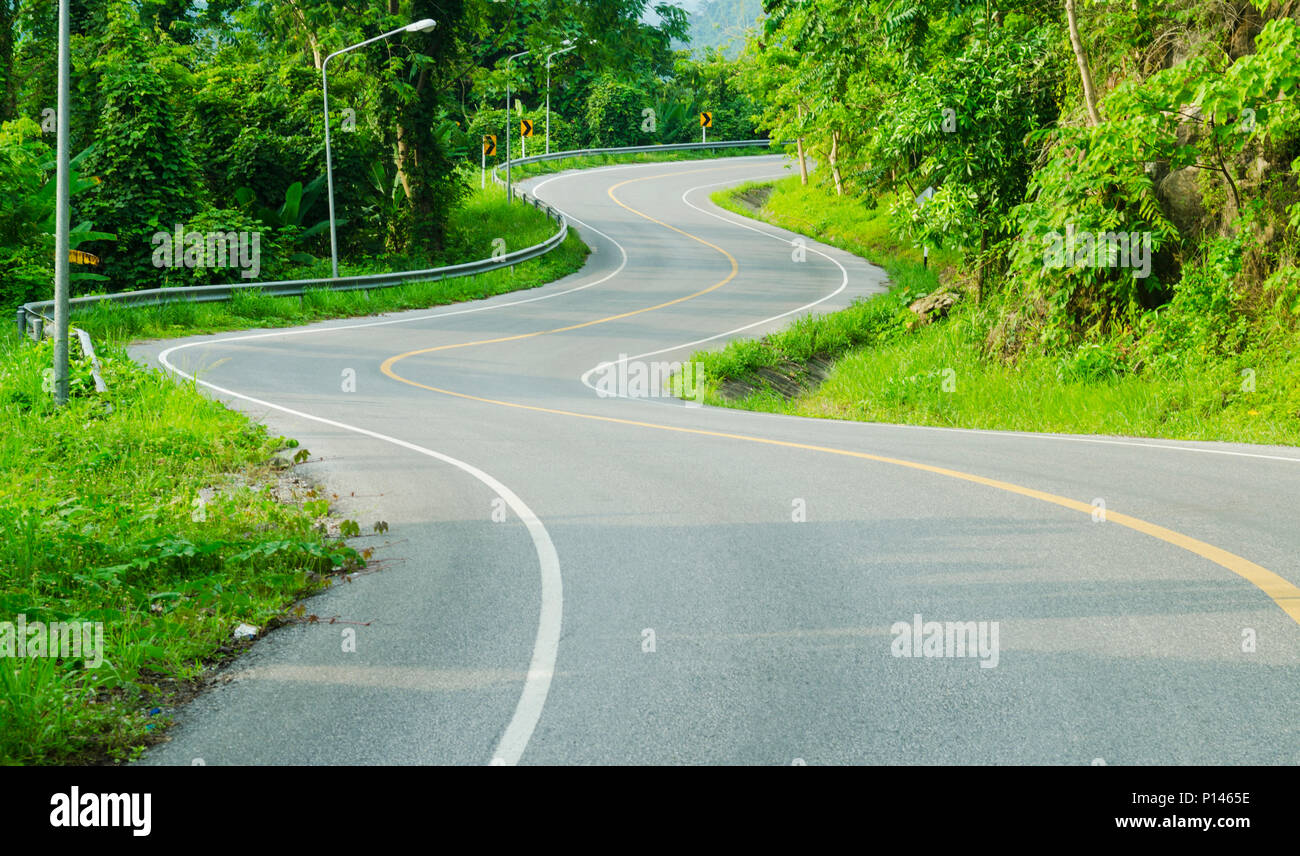 Asphalt road sharp curve along with tropical forest zigzag ahead Stock ...