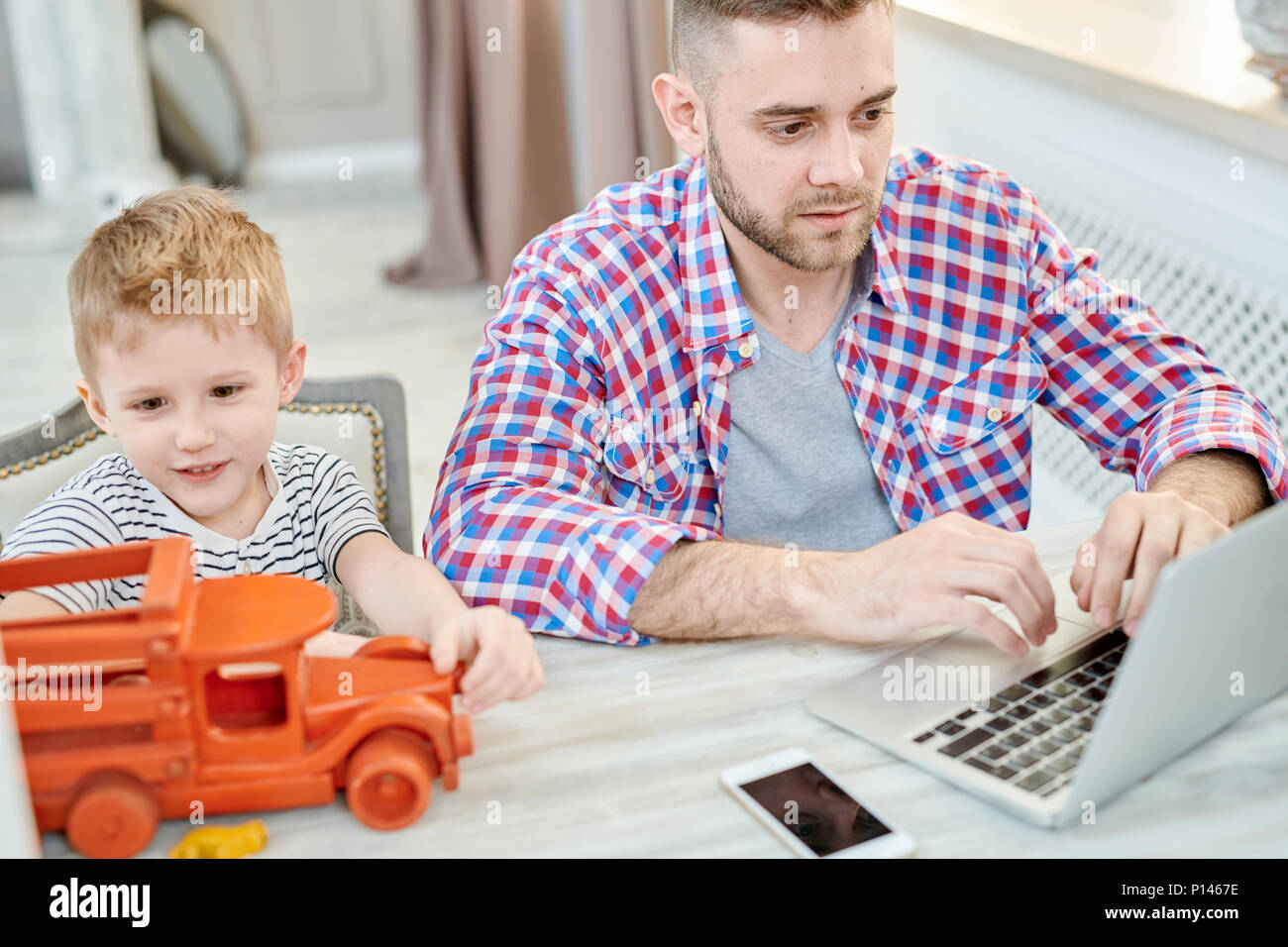 Young Father Working from Home Stock Photo - Alamy