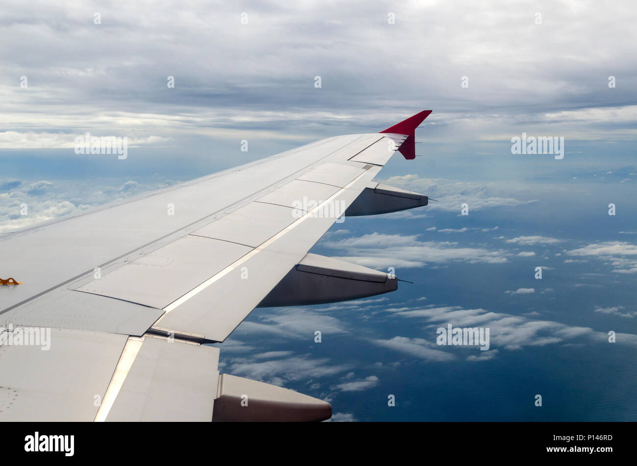 View from a jet plane window high on the blue skies Stock Photo - Alamy