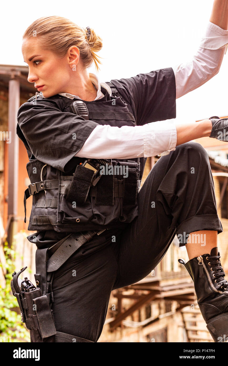 Powerful Woman Holding Gun. War Action Movie Style Stock Photo - Alamy