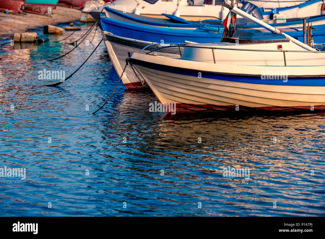 Reflection of boats in the water Stock Photo - Alamy