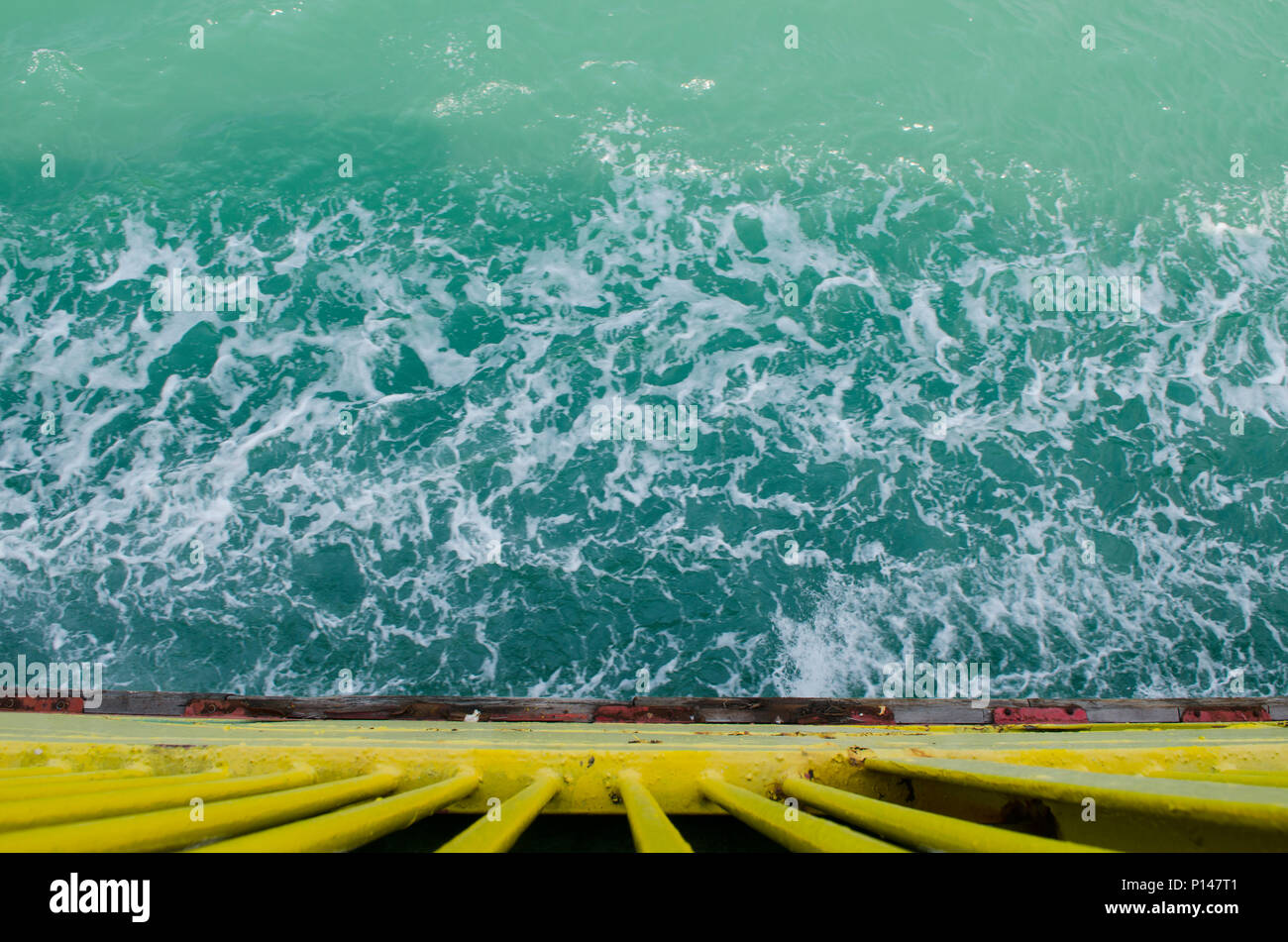 Blue sea with prop wash wake by Cargo ship Stock Photo - Alamy