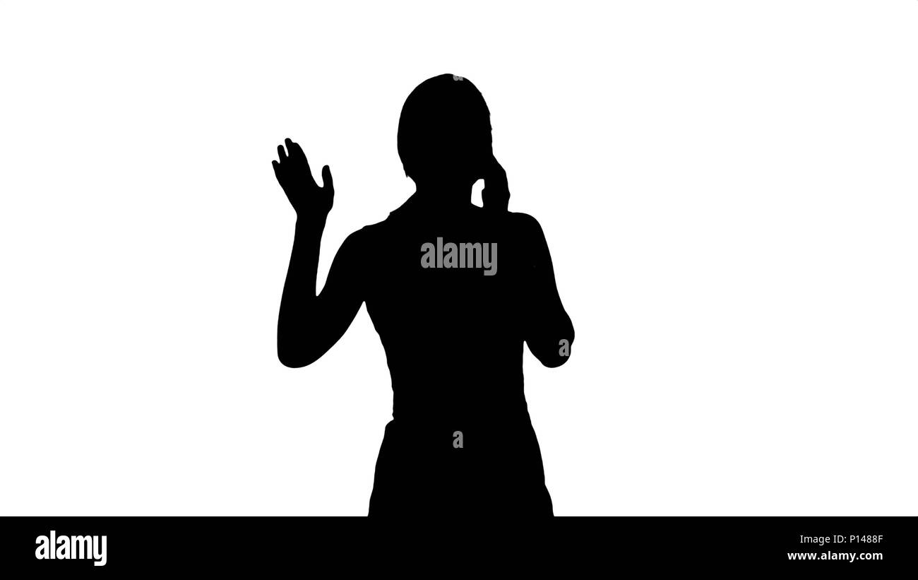 Silhouette Portrait of happy young Woman Talking On Mobile Phone Stock ...