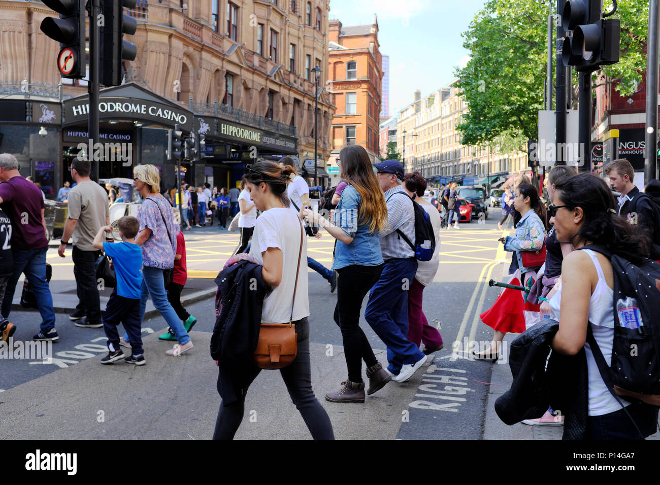 People crossing road, London, England, UK Stock Photo - Alamy