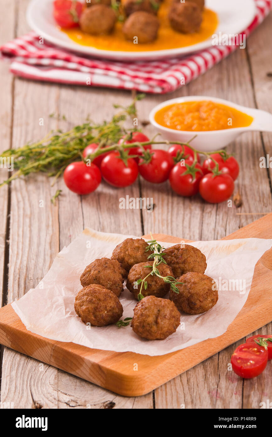 Meatballs with carrot purée Stock Photo - Alamy