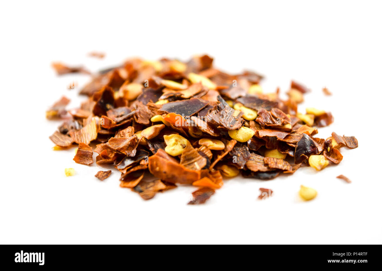 Dried crushed red pepper flakes - isolated, white background Stock ...
