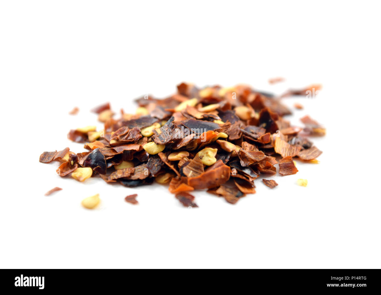 Dried crushed red pepper - isolated Stock Photo - Alamy