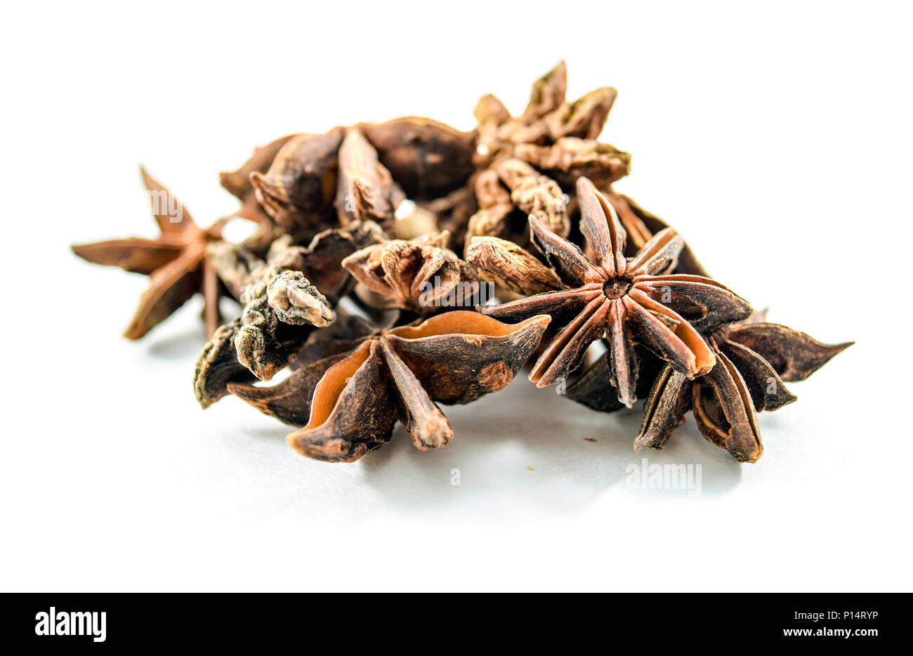 Pile of organic star anise spice - isolated on white background Stock ...