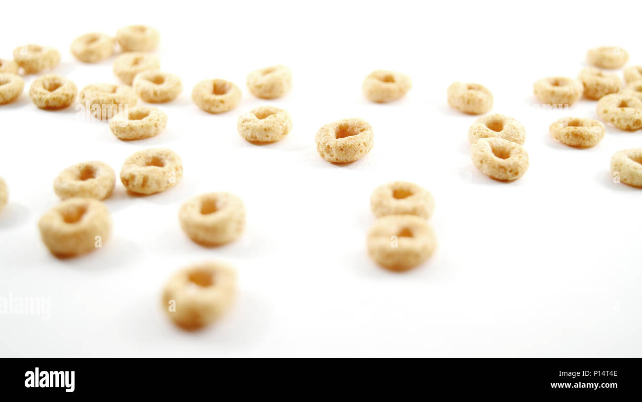Whole weat circular cereal Os on white background Stock Photo - Alamy