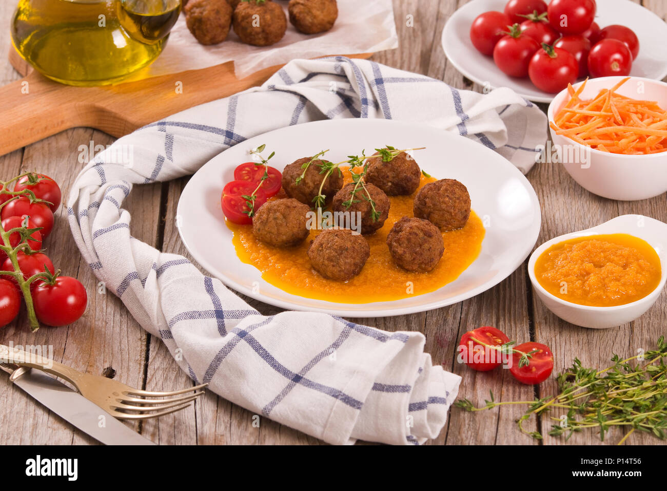 Meatballs with carrot purée Stock Photo - Alamy