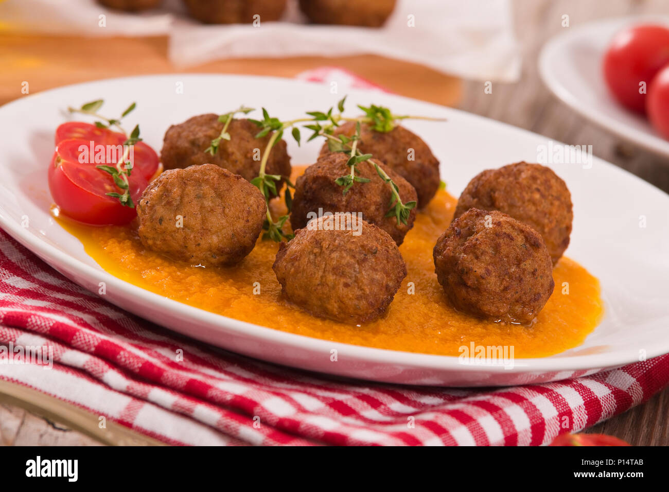 Meatballs with carrot purée Stock Photo - Alamy