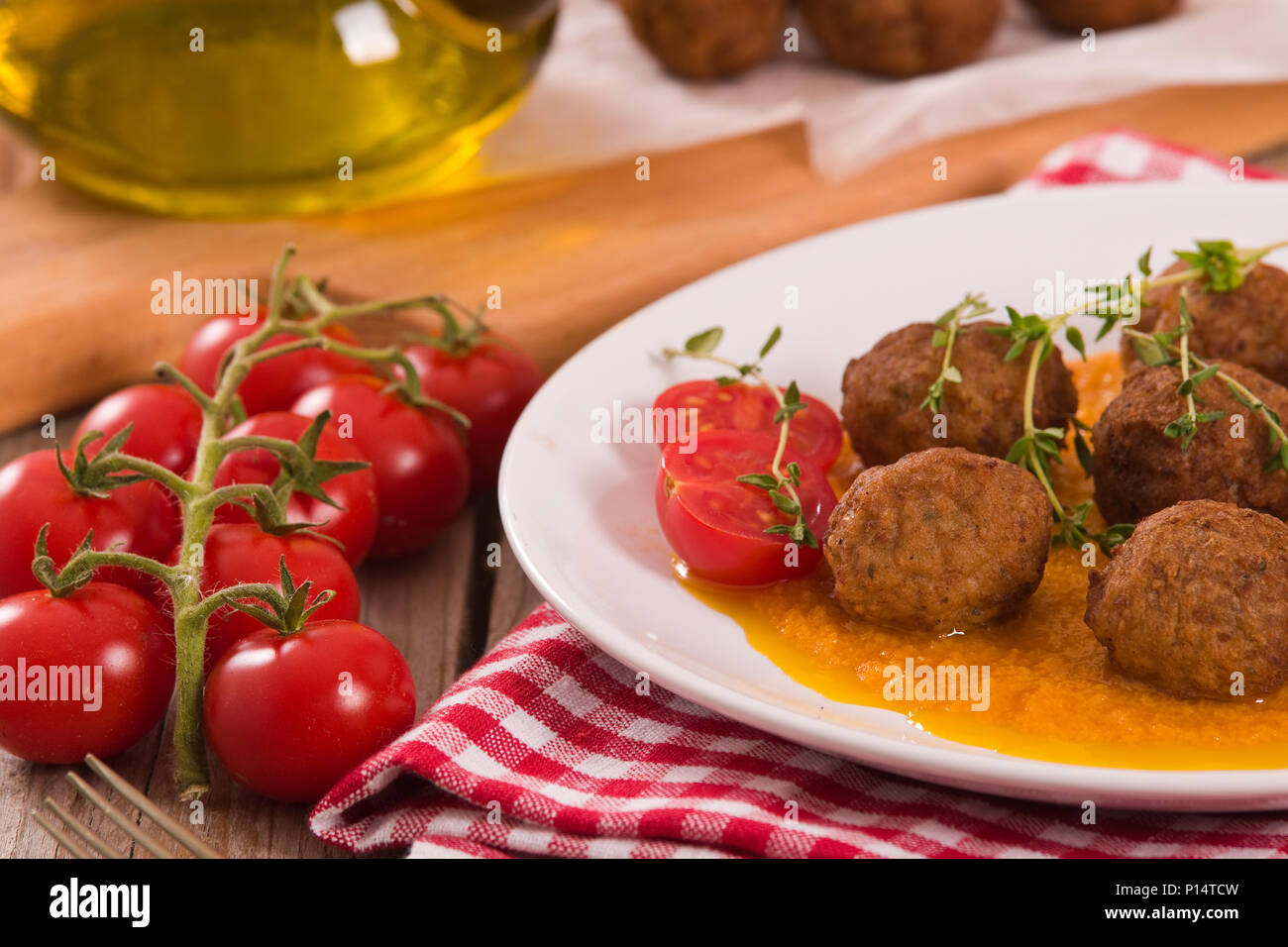 Meatballs with carrot purée Stock Photo - Alamy