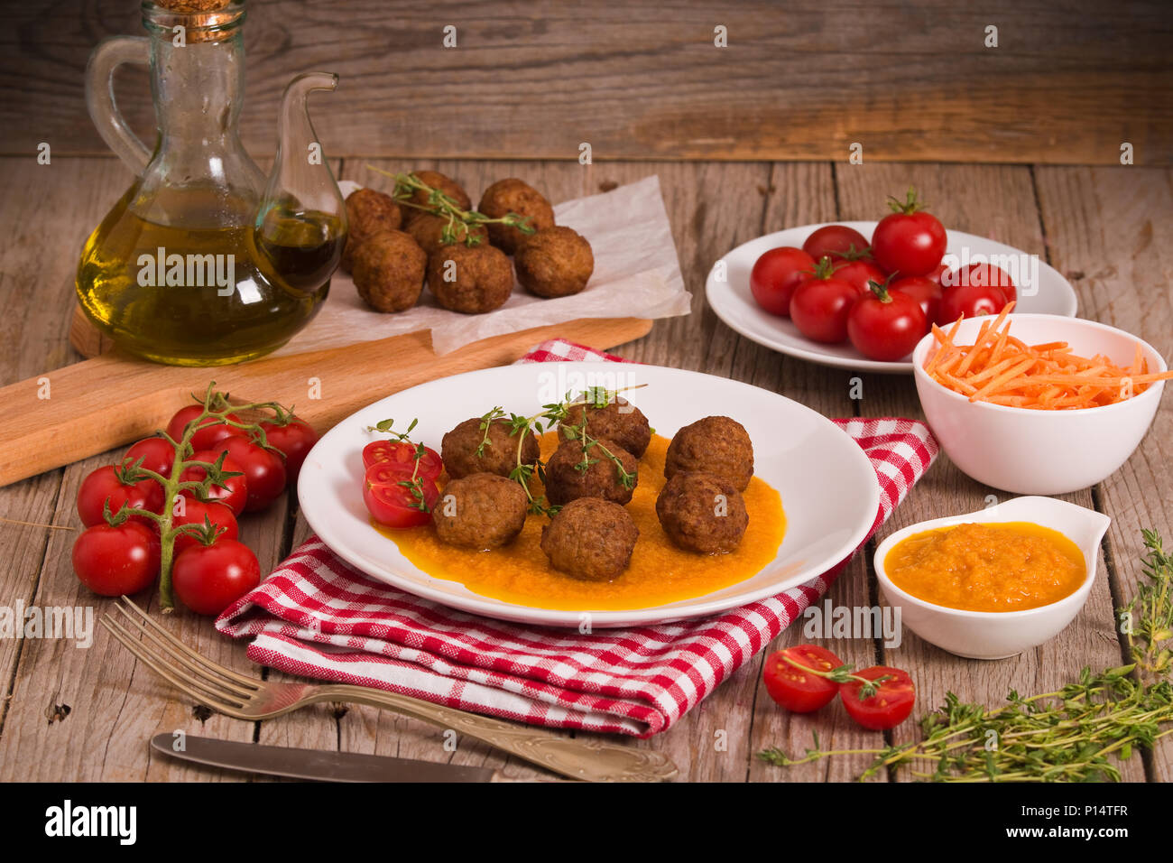 Meatballs with carrot purée Stock Photo - Alamy