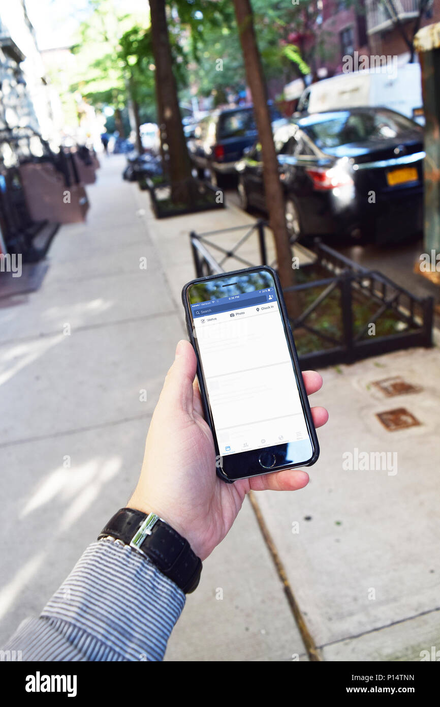 NEW YORK, NY - AUGUST 2nd, 2016: Apple iPhone 6 held in one hand ...