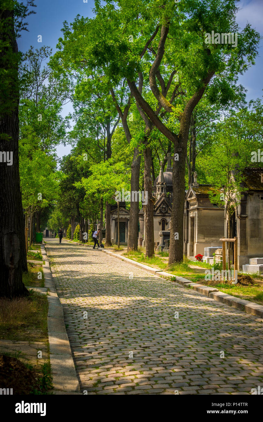 The wide, tree lined streets of Père Lachaise Cemetery are a perfect ...