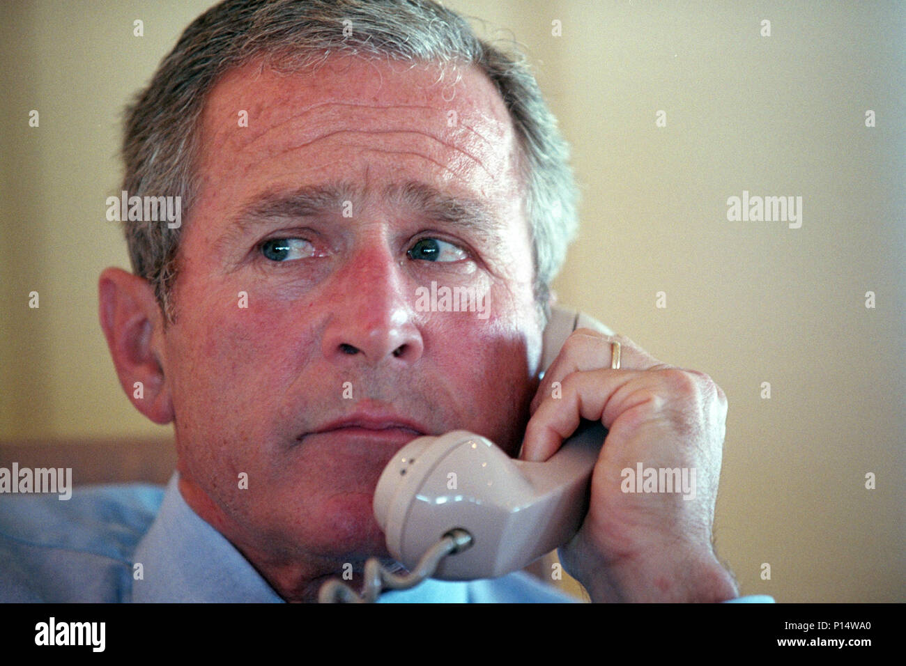 President George W. Bush confers with staff via telephone Tuesday, Sept ...