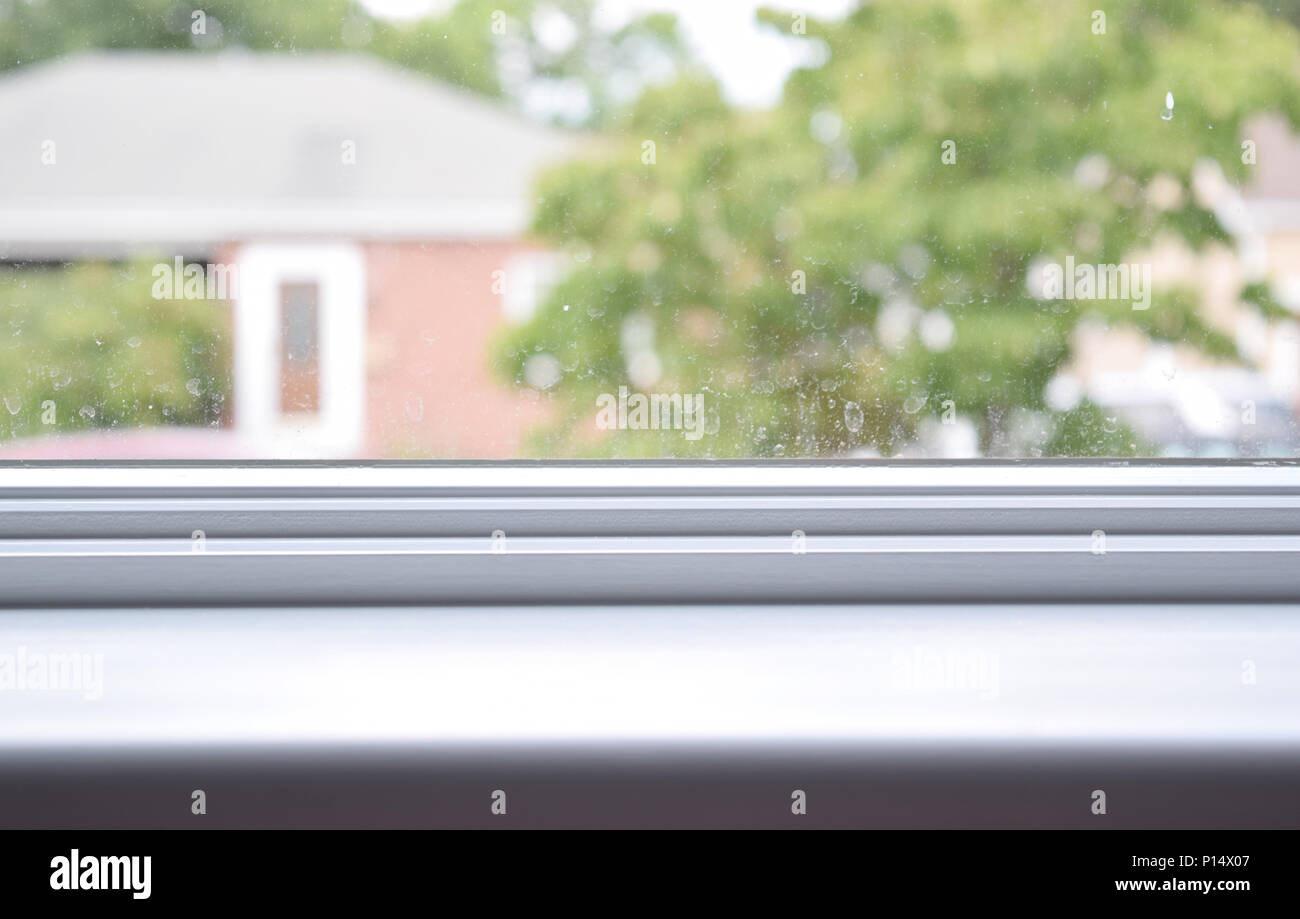 White windowsill surface or table with window in background, front ...