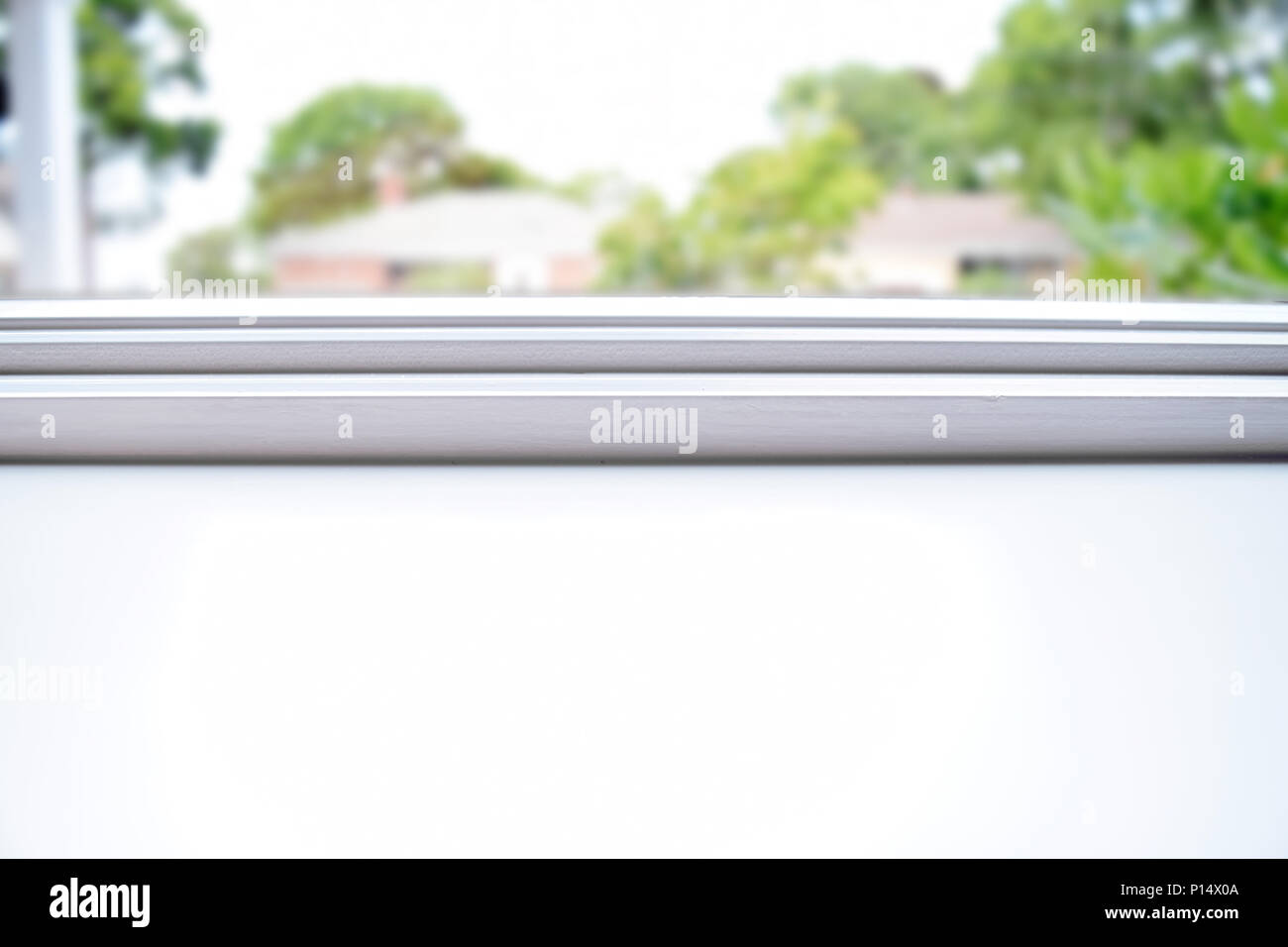 White windowsill surface or table with window in background, front ...