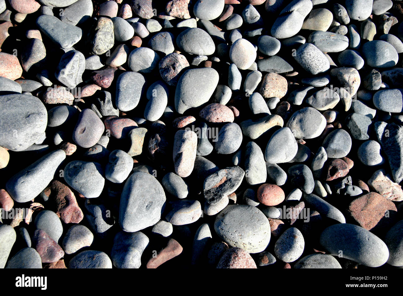 Pink and grey rocks and stones Stock Photo - Alamy