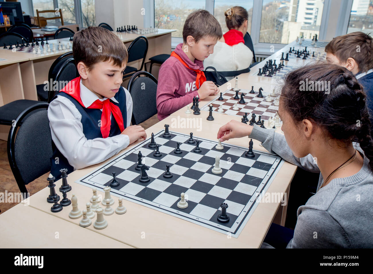 Russia, Vladivostok, 25/11/2017. Kids play chess during chess ...