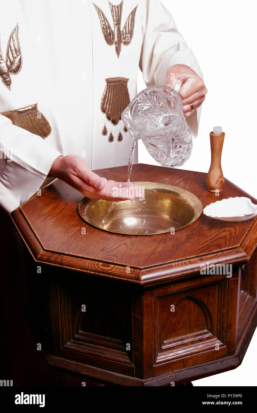 Pouring water baptismal font hi-res stock photography and images - Alamy
