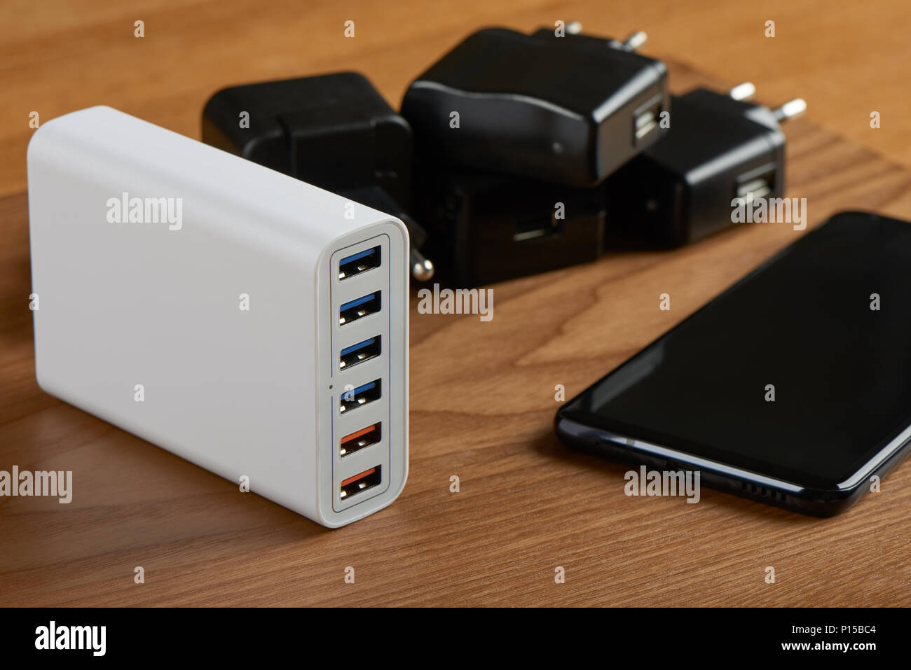 multiport charging station with smart phone and a heap of general ...