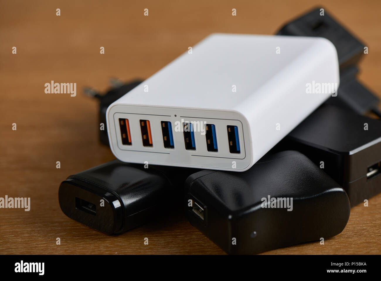 multiport charging station on a heap of general single port chargers ...