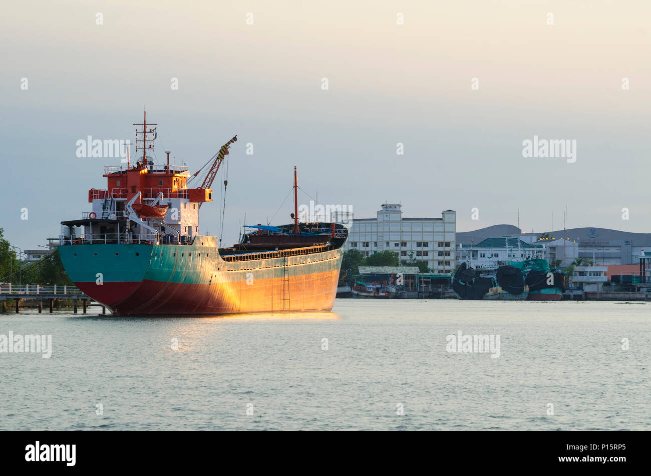 Large container ship arriving in port Stock Photo - Alamy