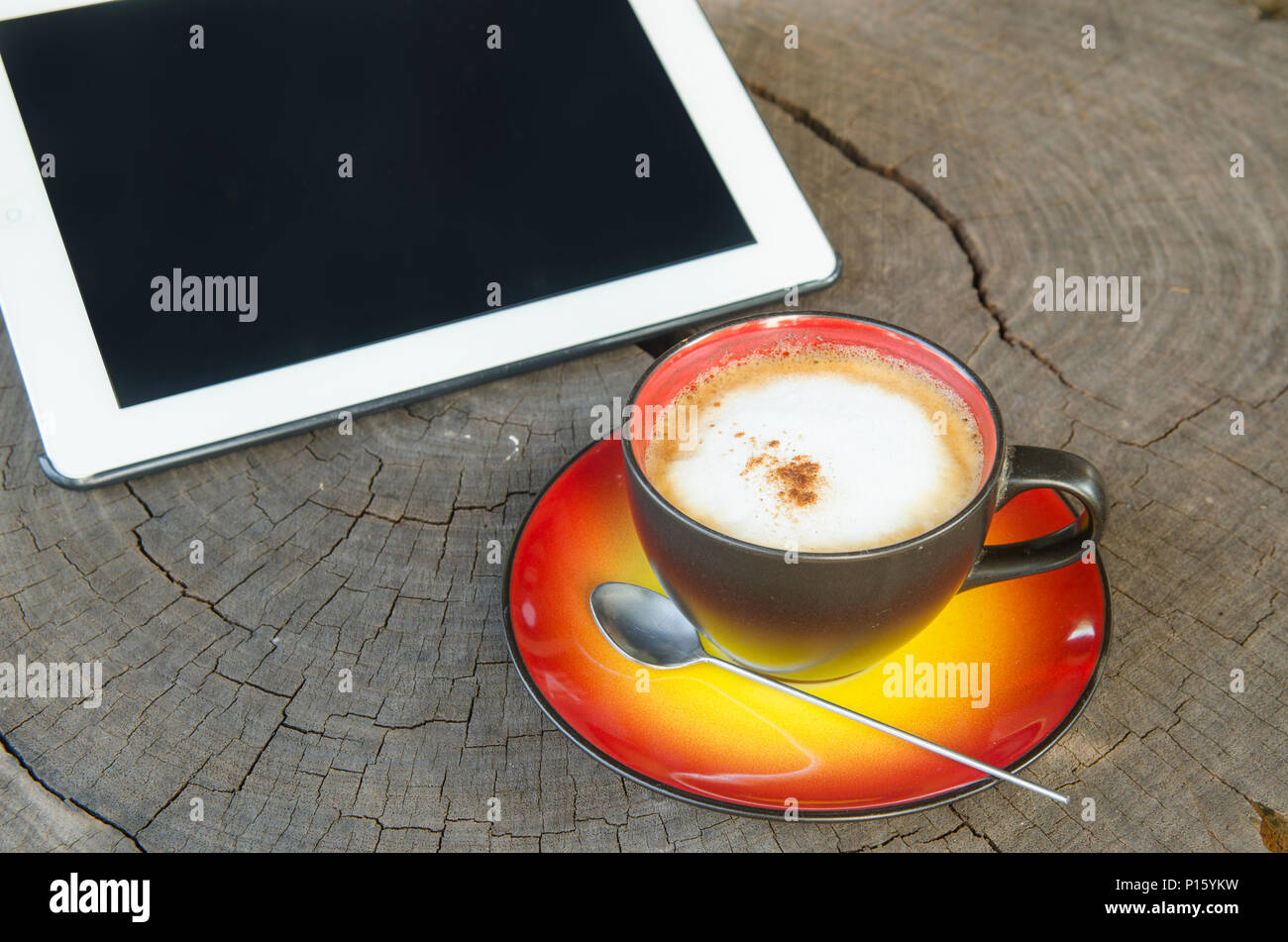 workplace, office desk: cap of coffee and tablet pc Stock Photo - Alamy