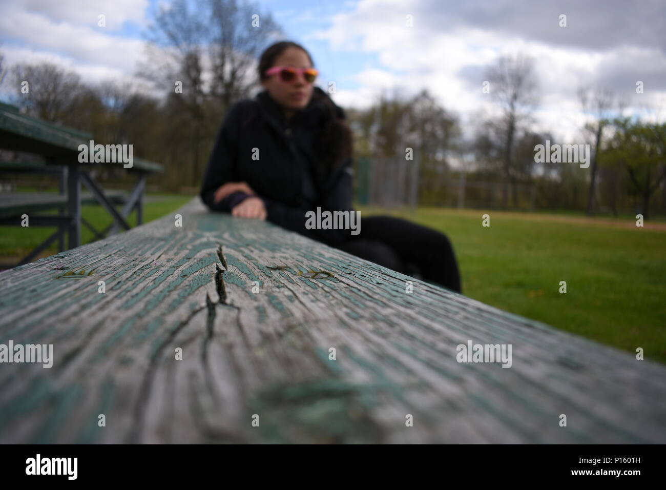 Girl poses on park bench hi-res stock photography and images - Alamy