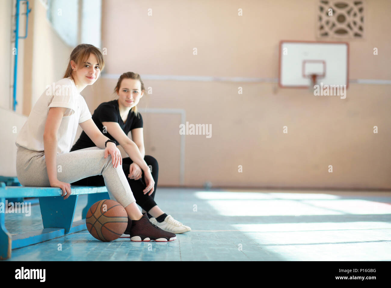 Girl young student in the gym playing a basketball Stock Photo - Alamy