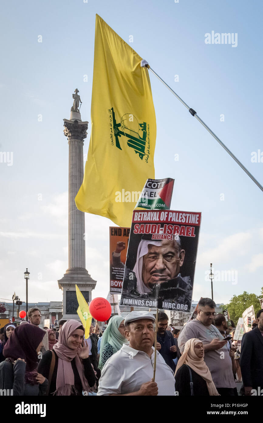London, UK. 10th June, 2018. Hezbollah flags fly at Al Quds Day rally ...