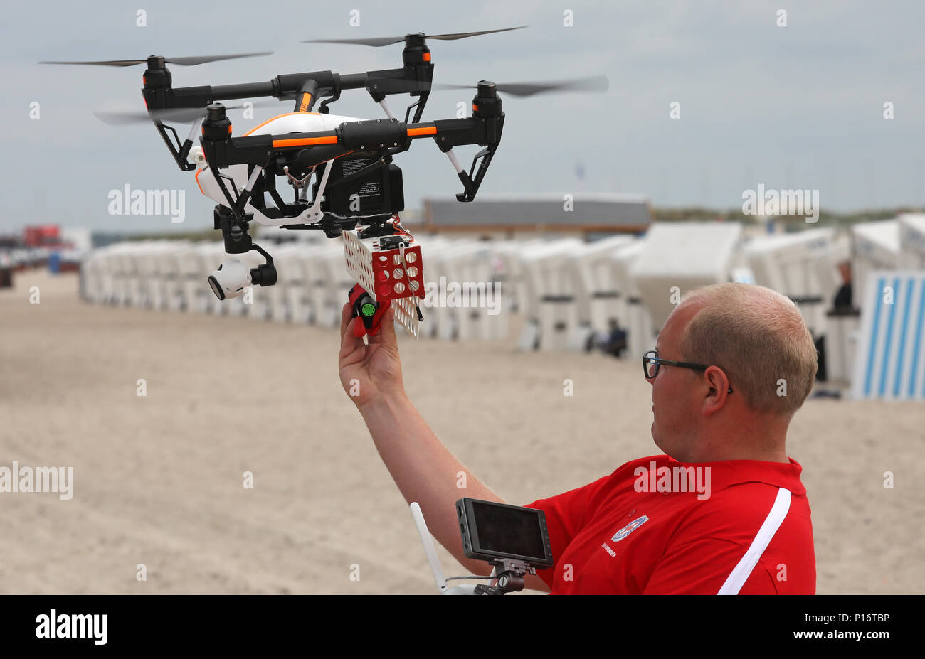 11 June 2018, Warnemuende, Germany: Life guard and pilot Lukas Knaup ...