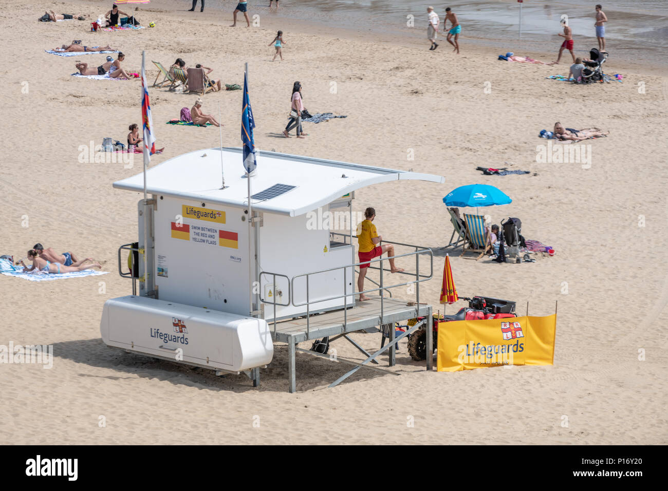 Bournemouth, UK. 11th June 2018. RNLI lifeguards watch over tourists ...