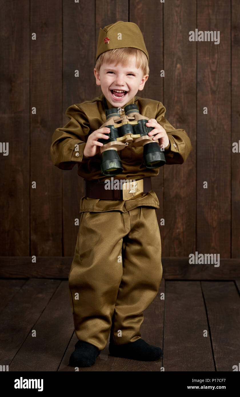 children are dressed as soldier in retro military uniforms Stock Photo ...