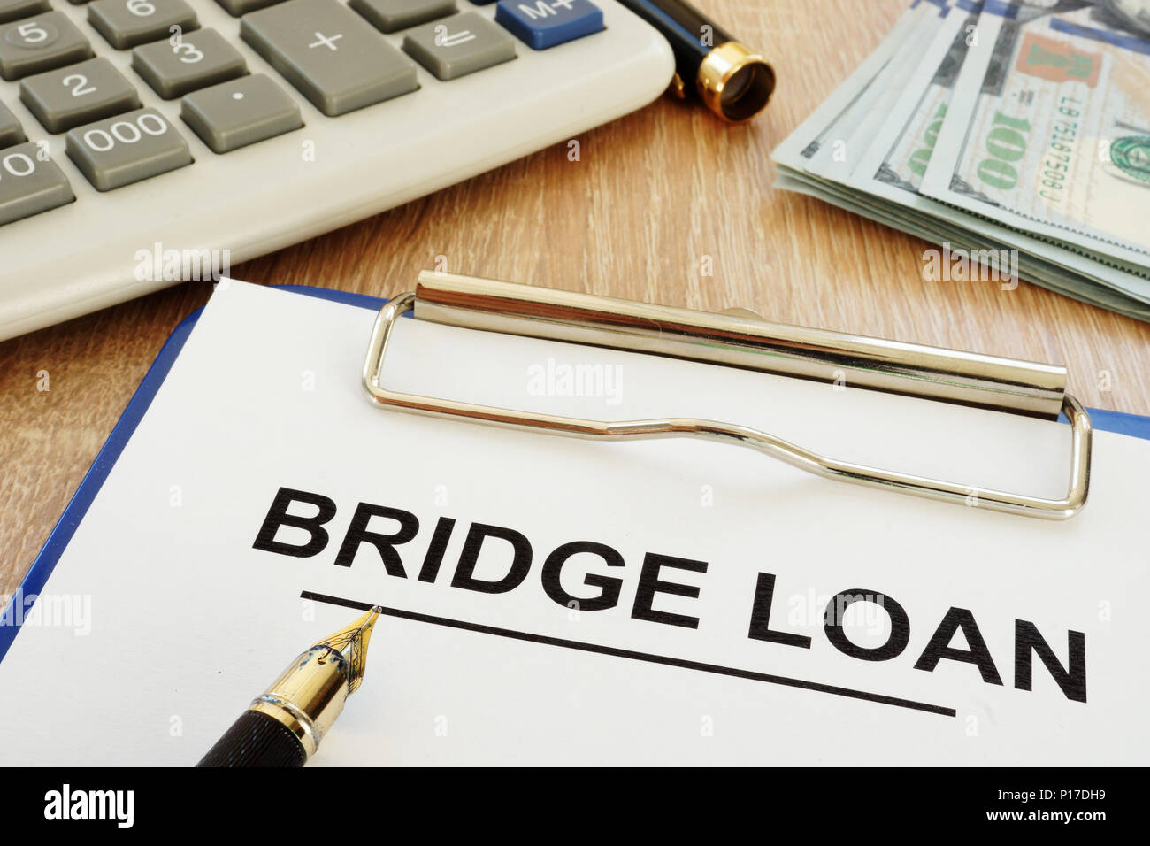 Bridge loan form and clipboard on a desk Stock Photo - Alamy