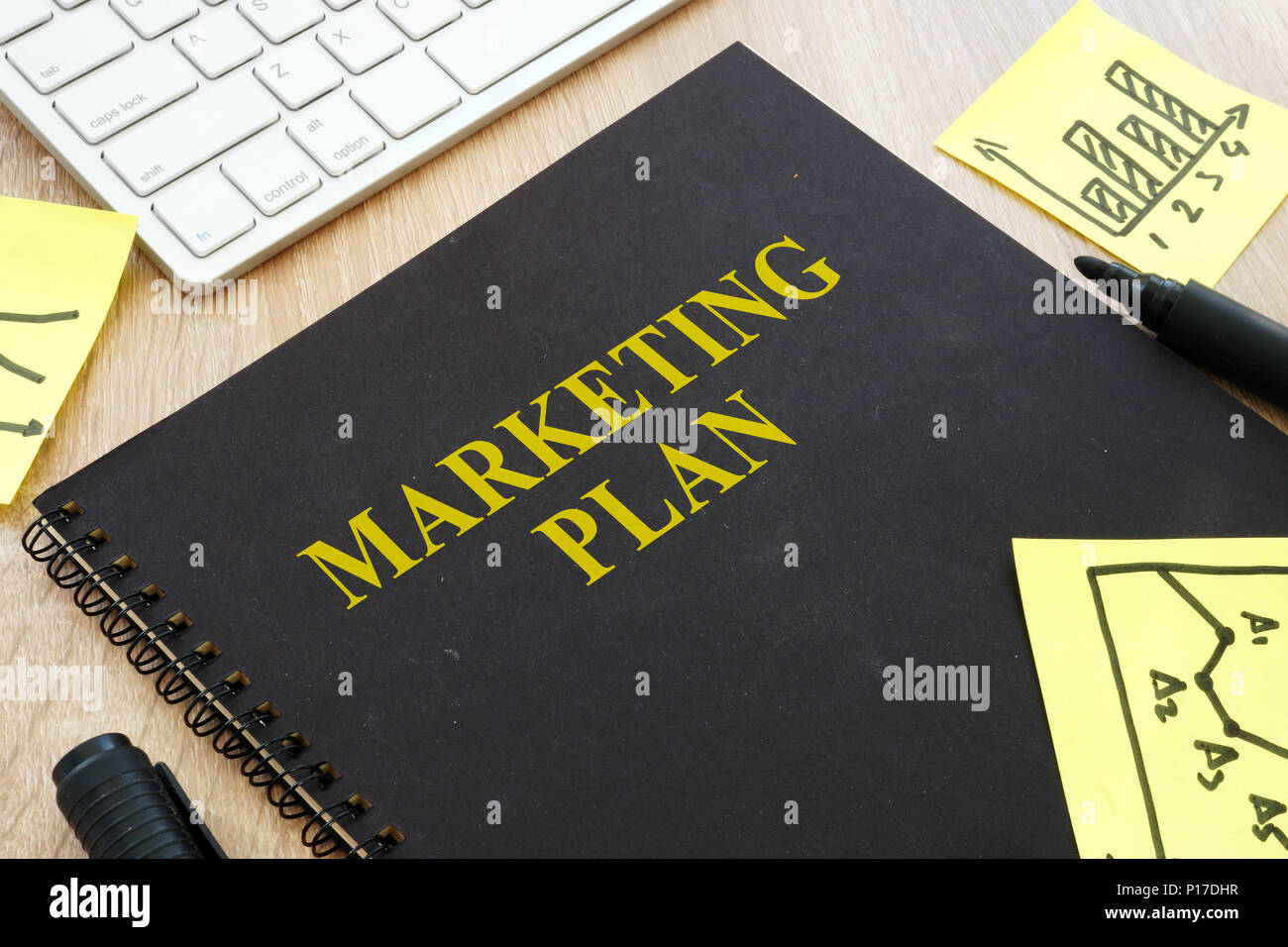Marketing plan and keyboard on a desk Stock Photo - Alamy