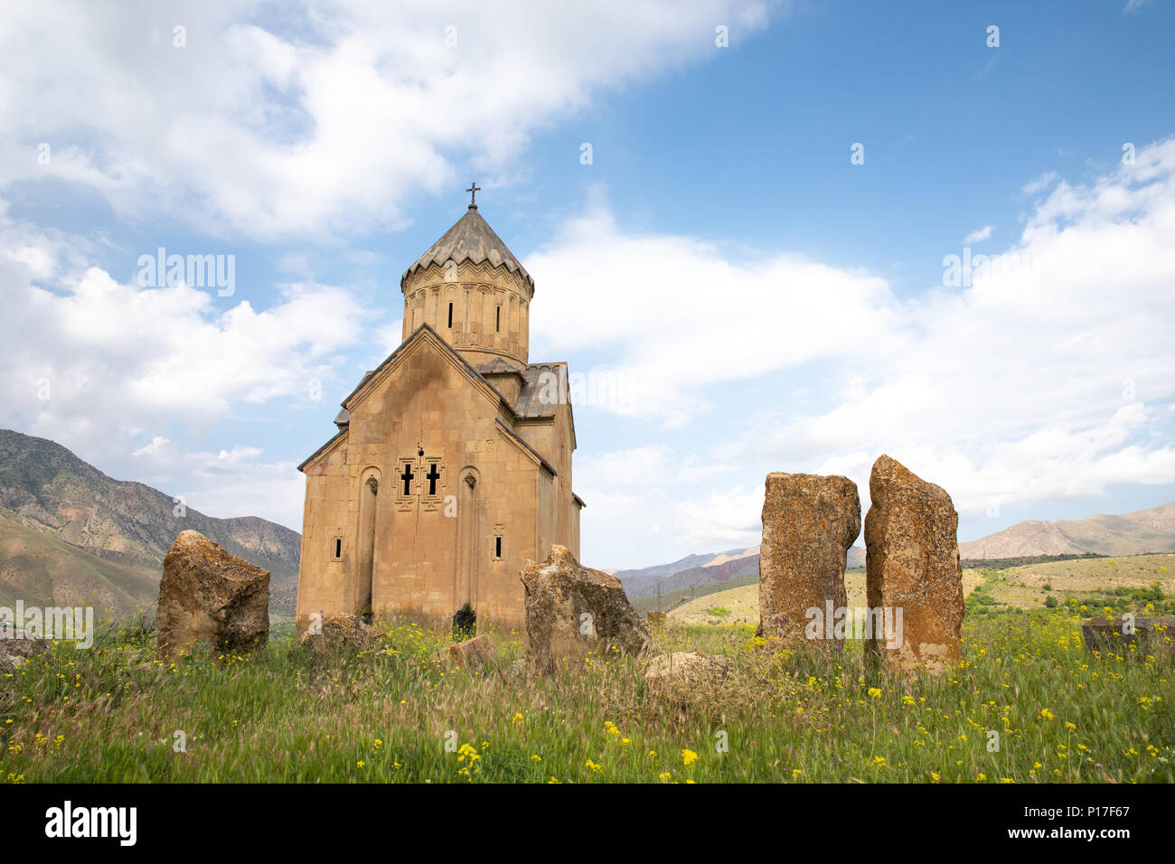 Little medieval church on top of a mountain with old grave stones ...