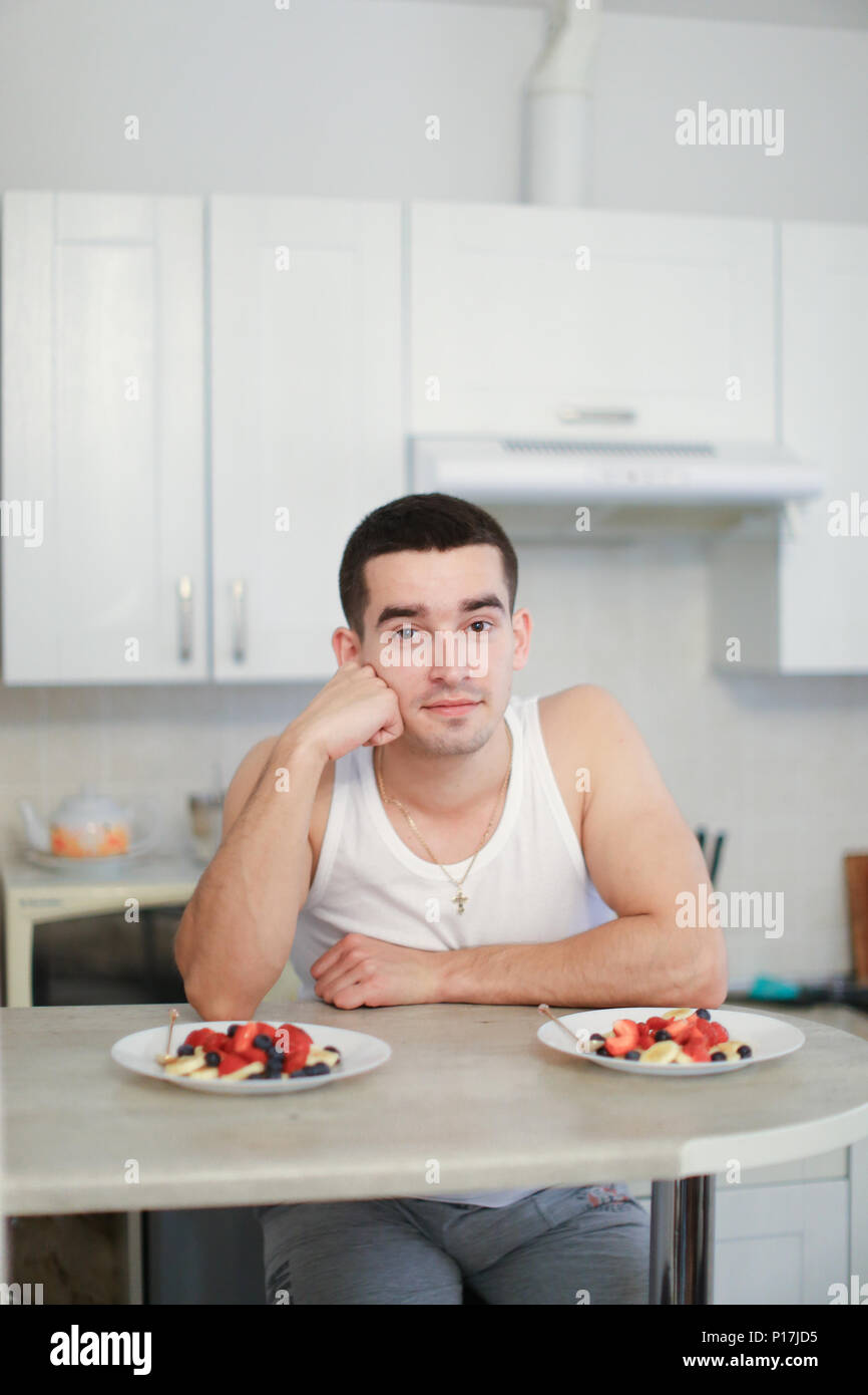 Man eating porridge berries hi-res stock photography and images - Alamy