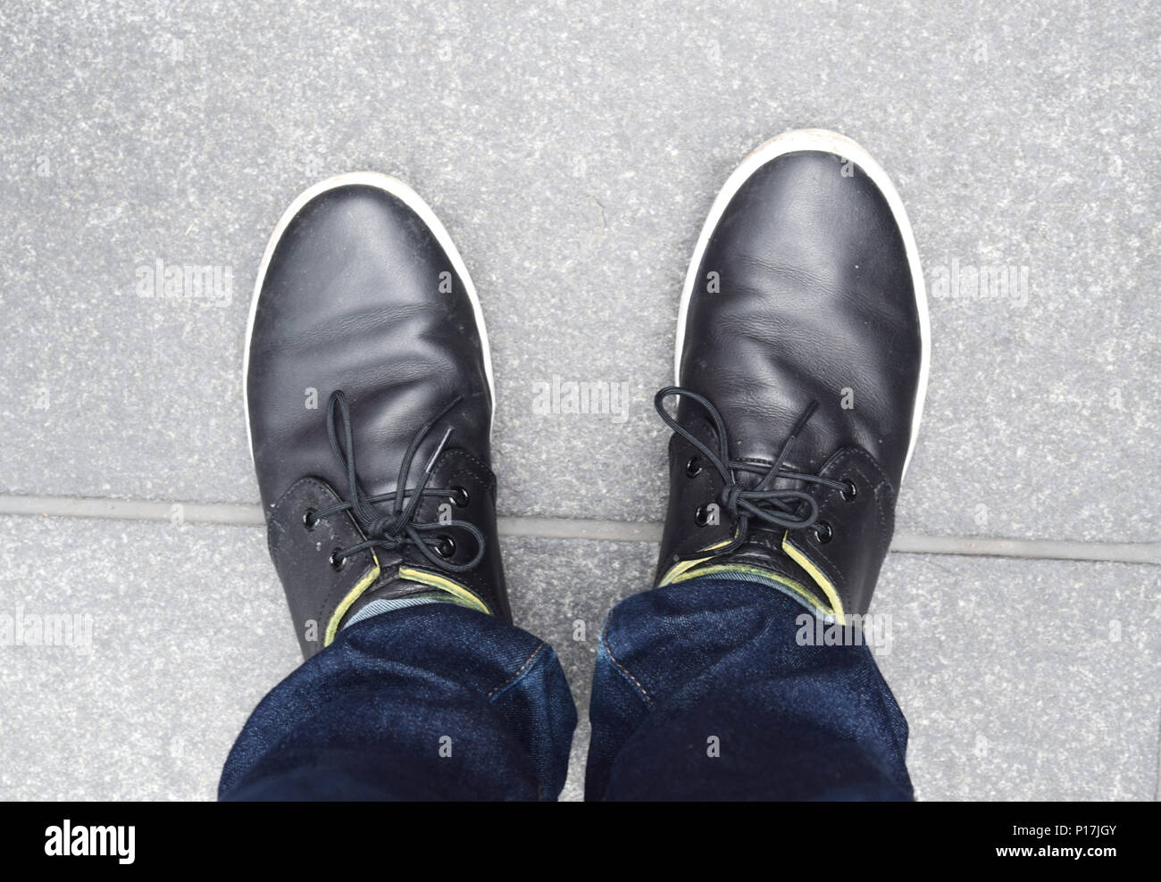Black shoes on the ground in Times Square, New York Stock Photo - Alamy
