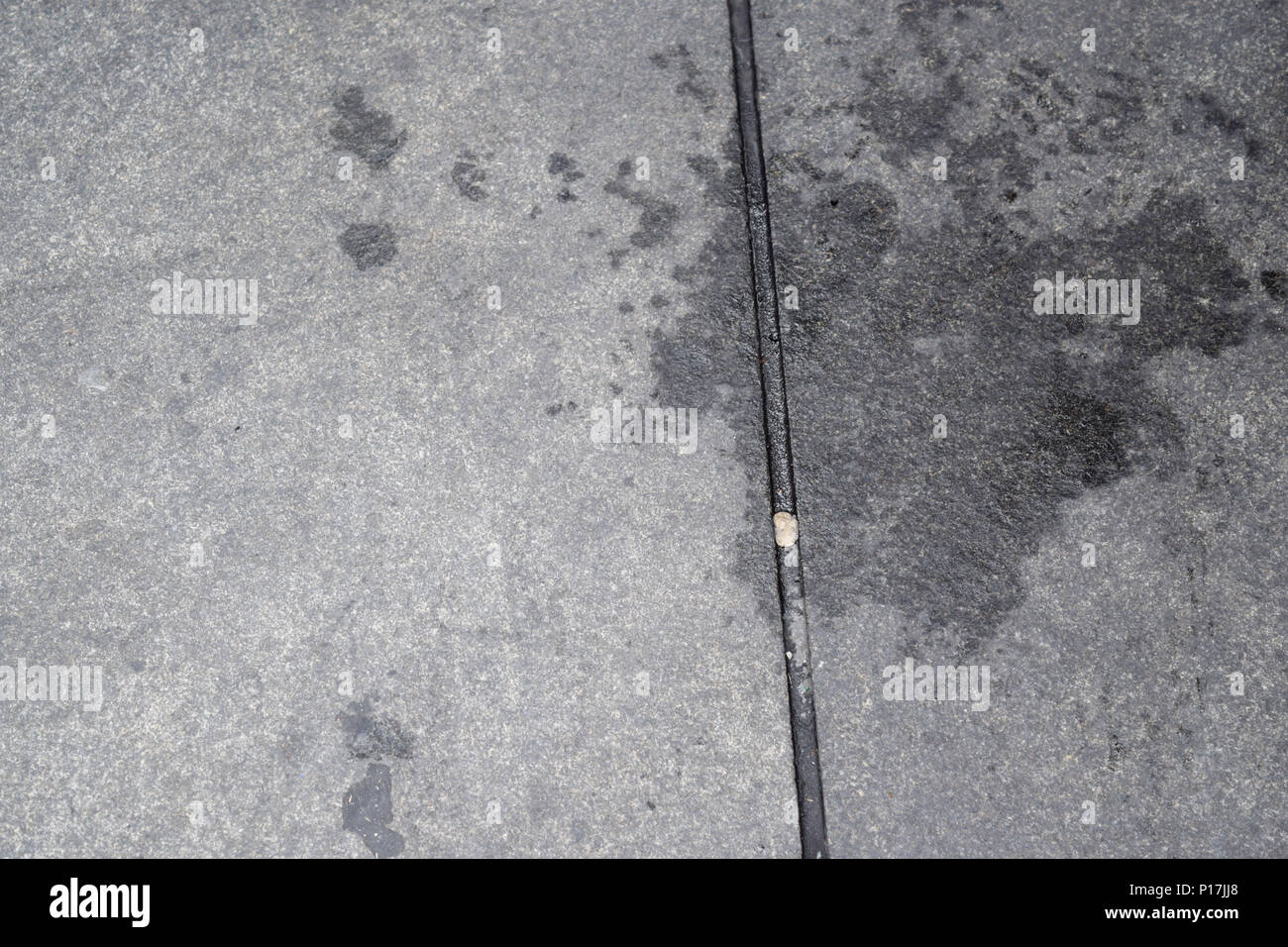 Oil stain on sidewalk with spit out gum in Times Square, New York Stock ...