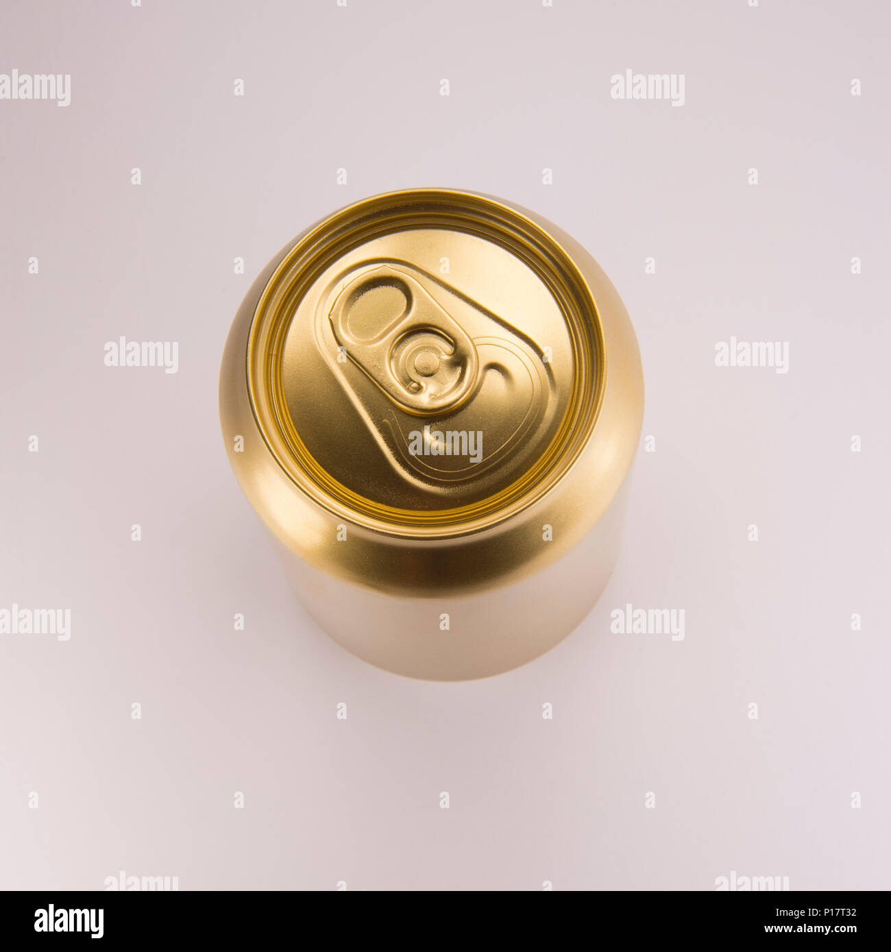 Gold can on white background Stock Photo - Alamy