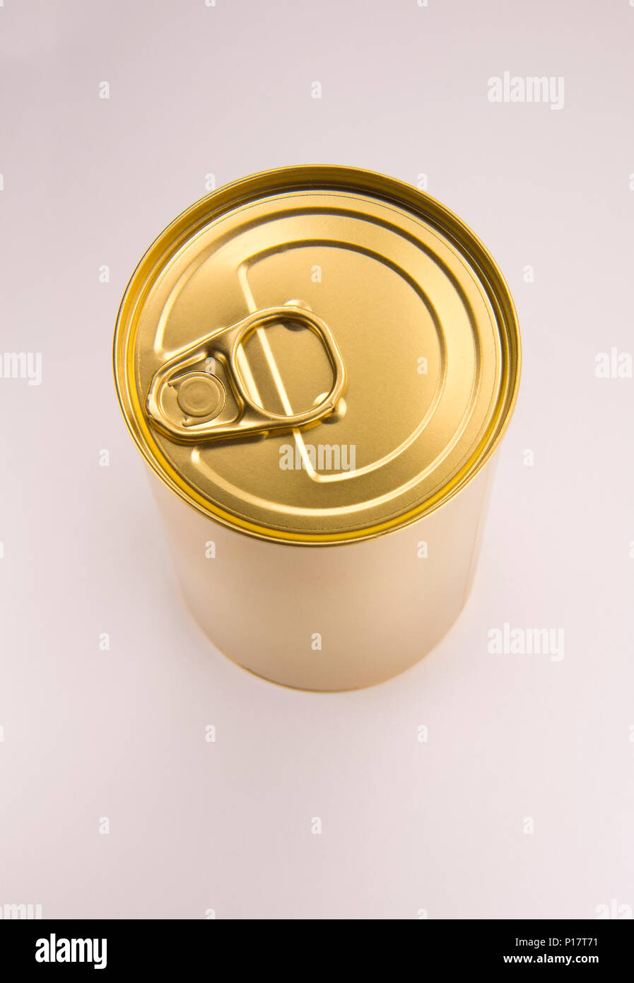 Gold can on white background Stock Photo - Alamy