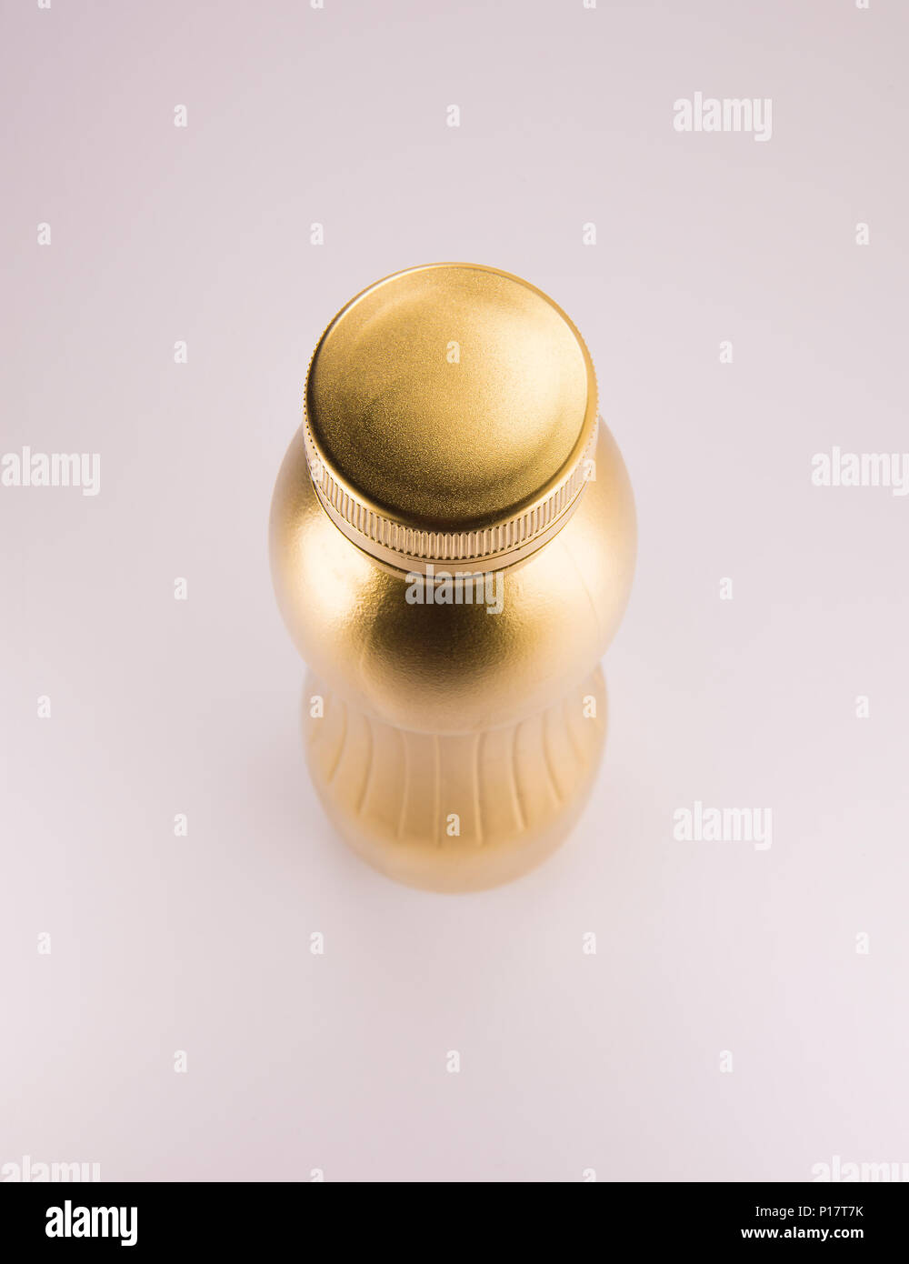 Gold plastic bottle Stock Photo - Alamy