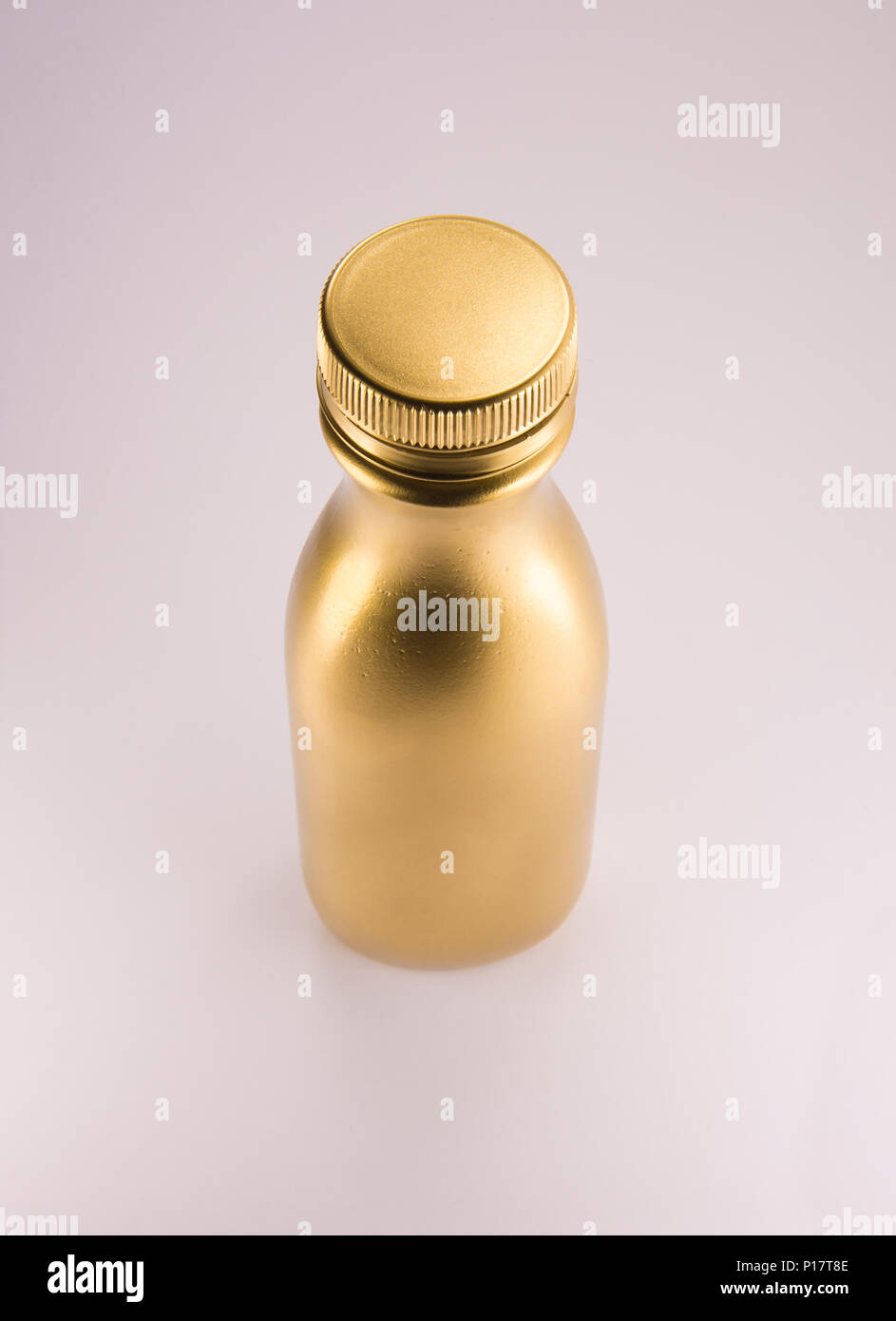 Gold plastic bottle Stock Photo - Alamy