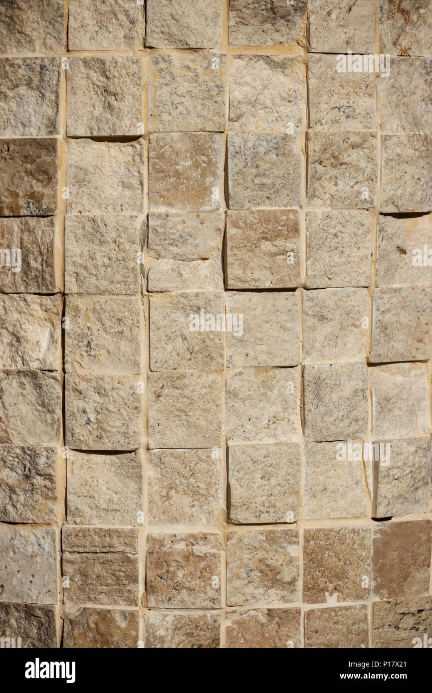 Wall of beige square stone blocks Stock Photo - Alamy