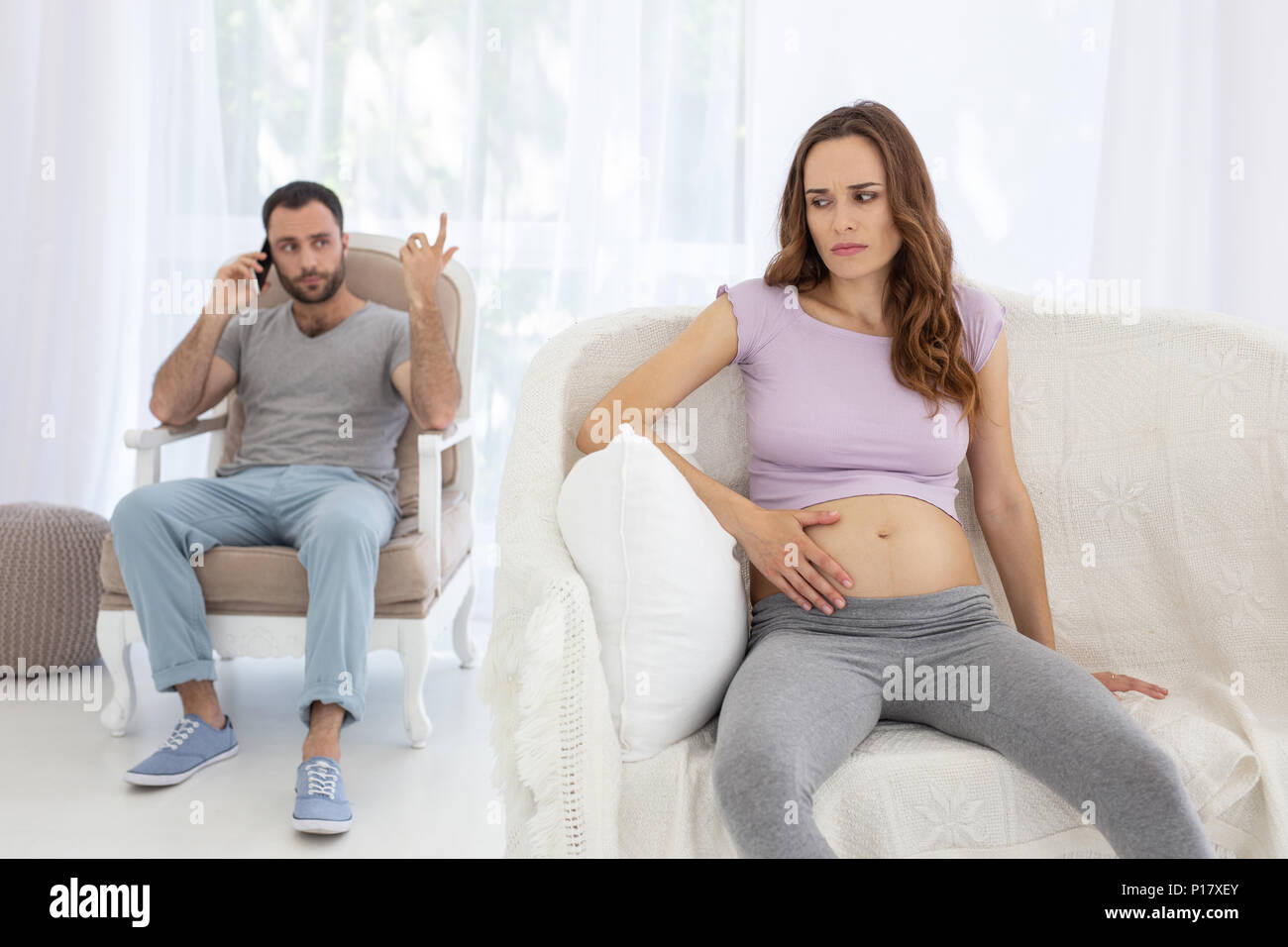 Worried pregnant woman grumping Stock Photo - Alamy